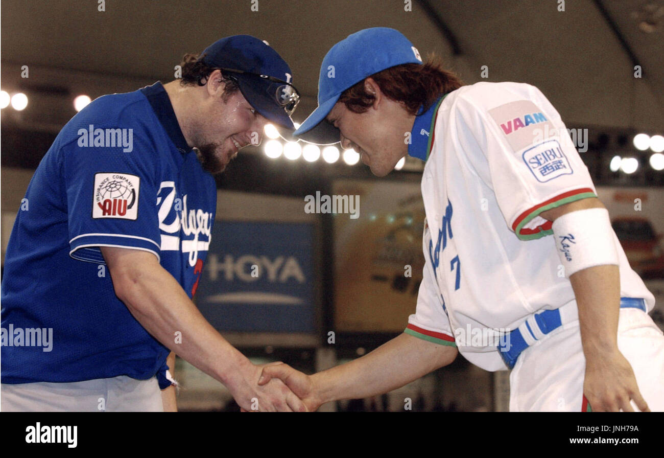 TOKYO, Japan - Eric Gagne of the Los Angeles Dodgers shakes hands with ...