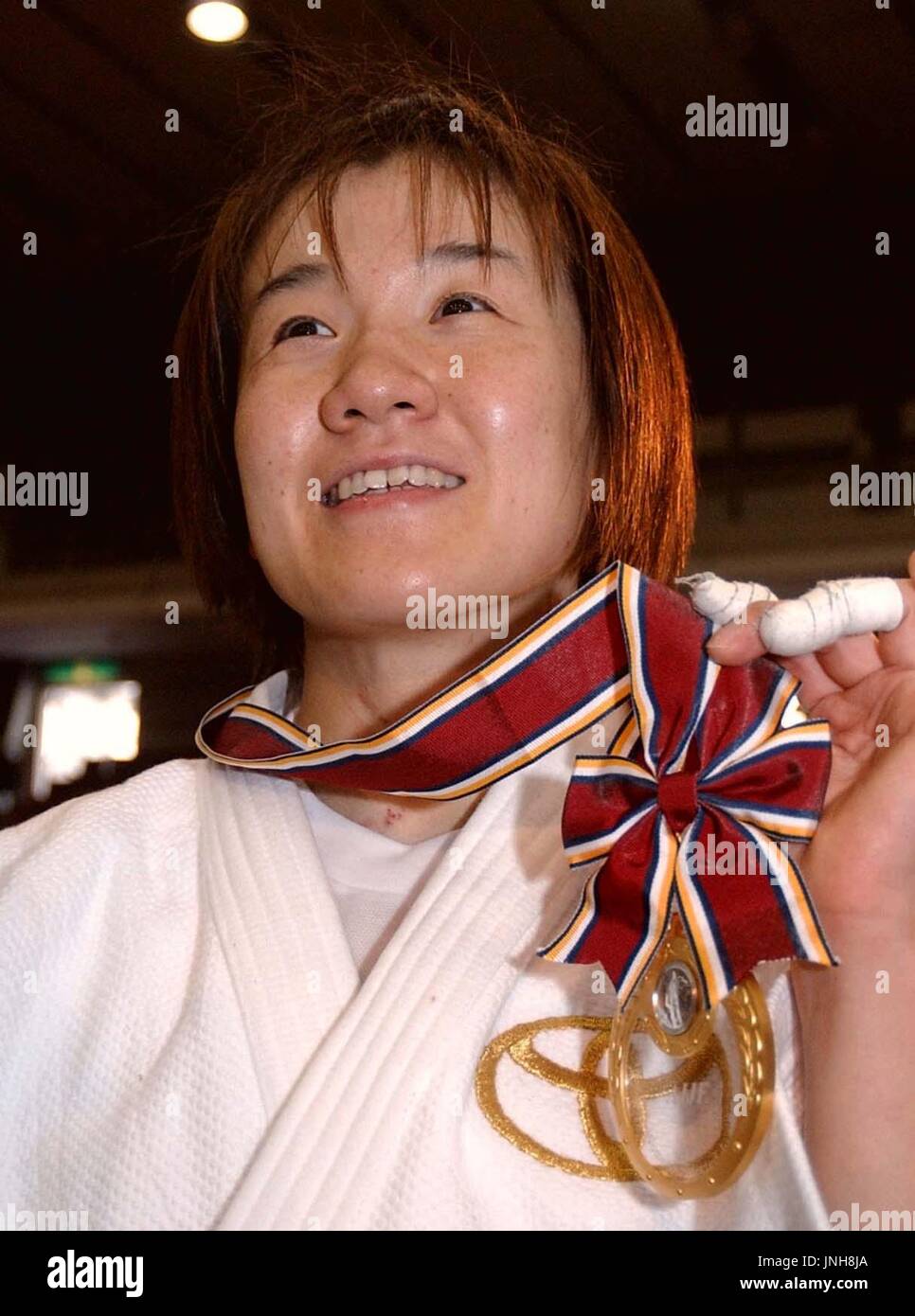 YOKOHAMA, Japan - Sydney Olympics gold medalist Ryoko Tamura holds up ...
