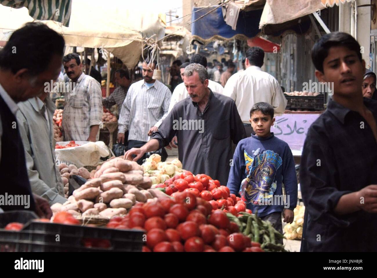 BAGHDAD, Iraq - Locals shop at a food market in Baghdad on April 13 ...
