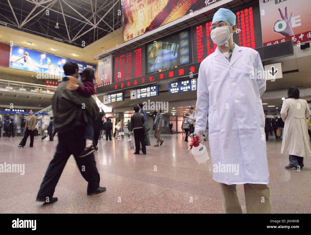 BEIJING, China - A sanitary official carries an antiseptic spray at ...