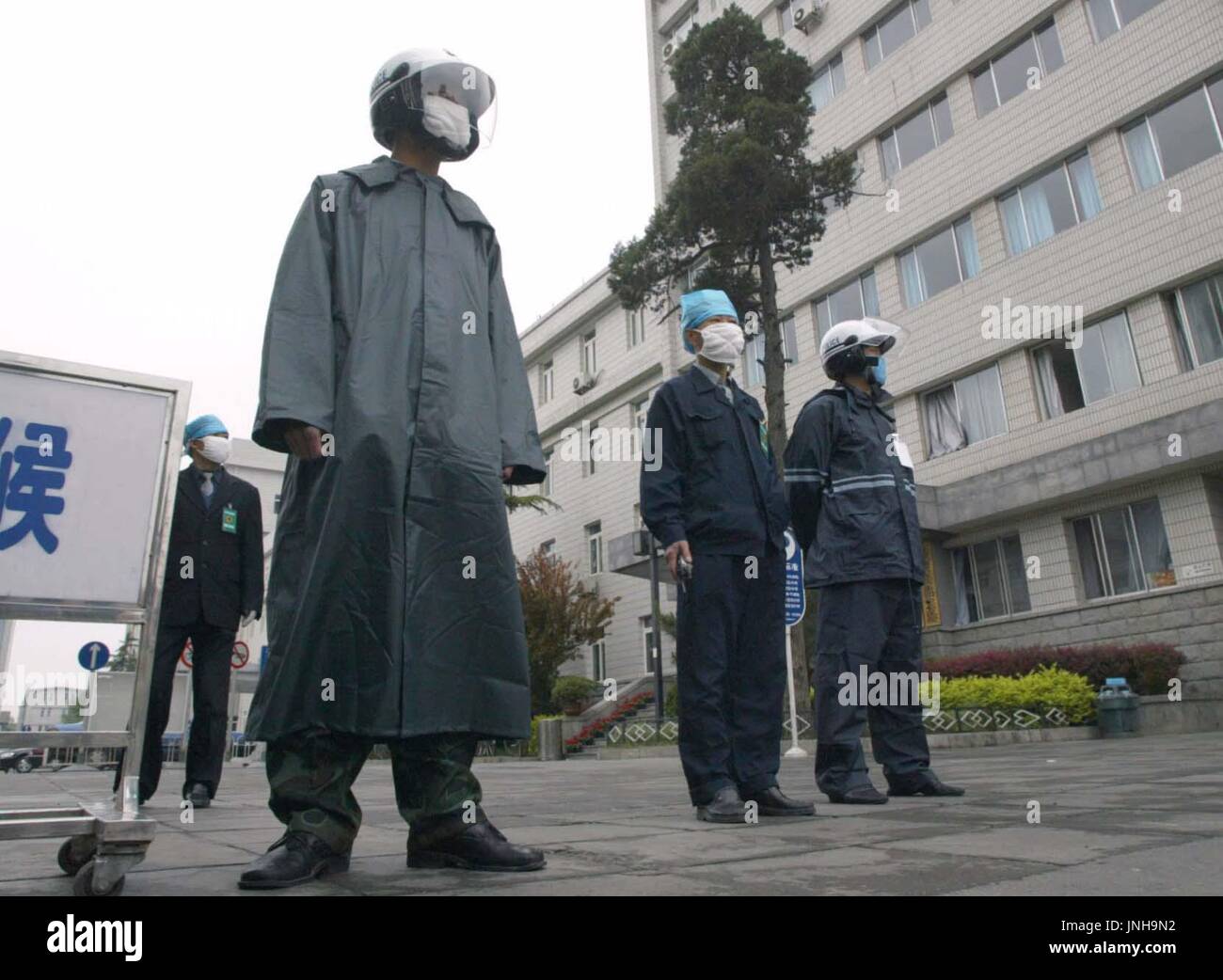 BEIJING, China - Police officers wearing face masks and helmets stand ...