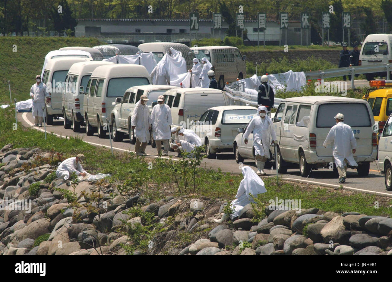 VILLAGE OF IZUMI, Japan - Members of the white-robed doomsday group ...