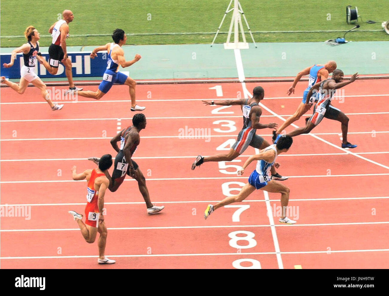 OSAKA, Japan - World record holder Tim Montgomery (lane No. 5) coasted ...