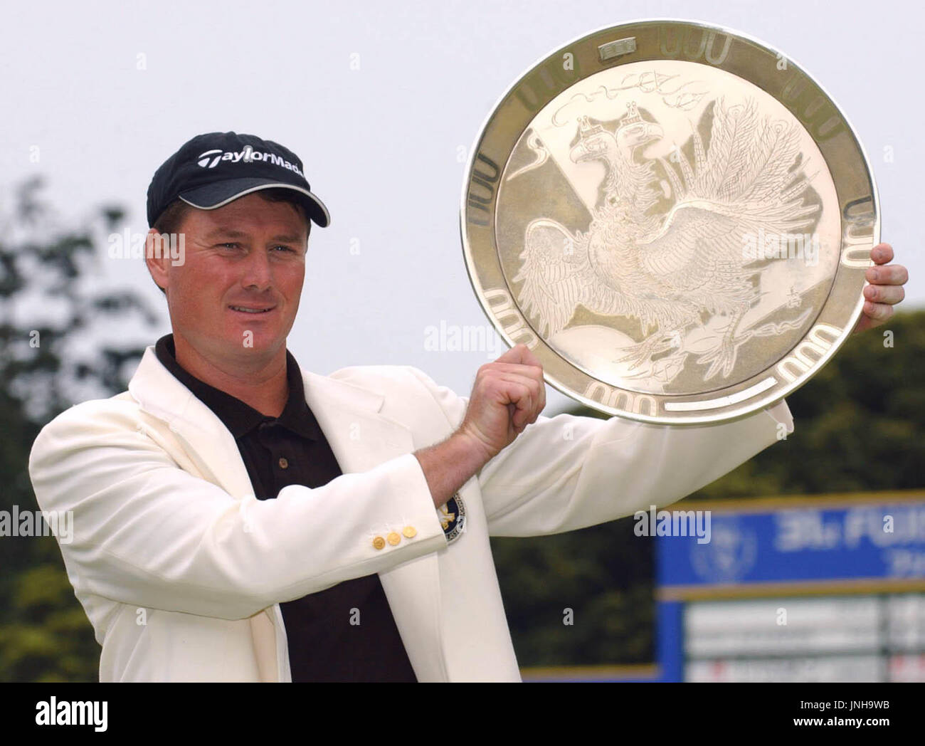 ITO, Japan - Todd Hamilton of the United States raises a trophy after ...