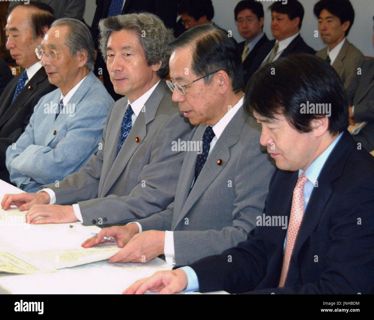 TOKYO, Japan - Prime Minister Junichiro Koizumi (C) presides over a ...