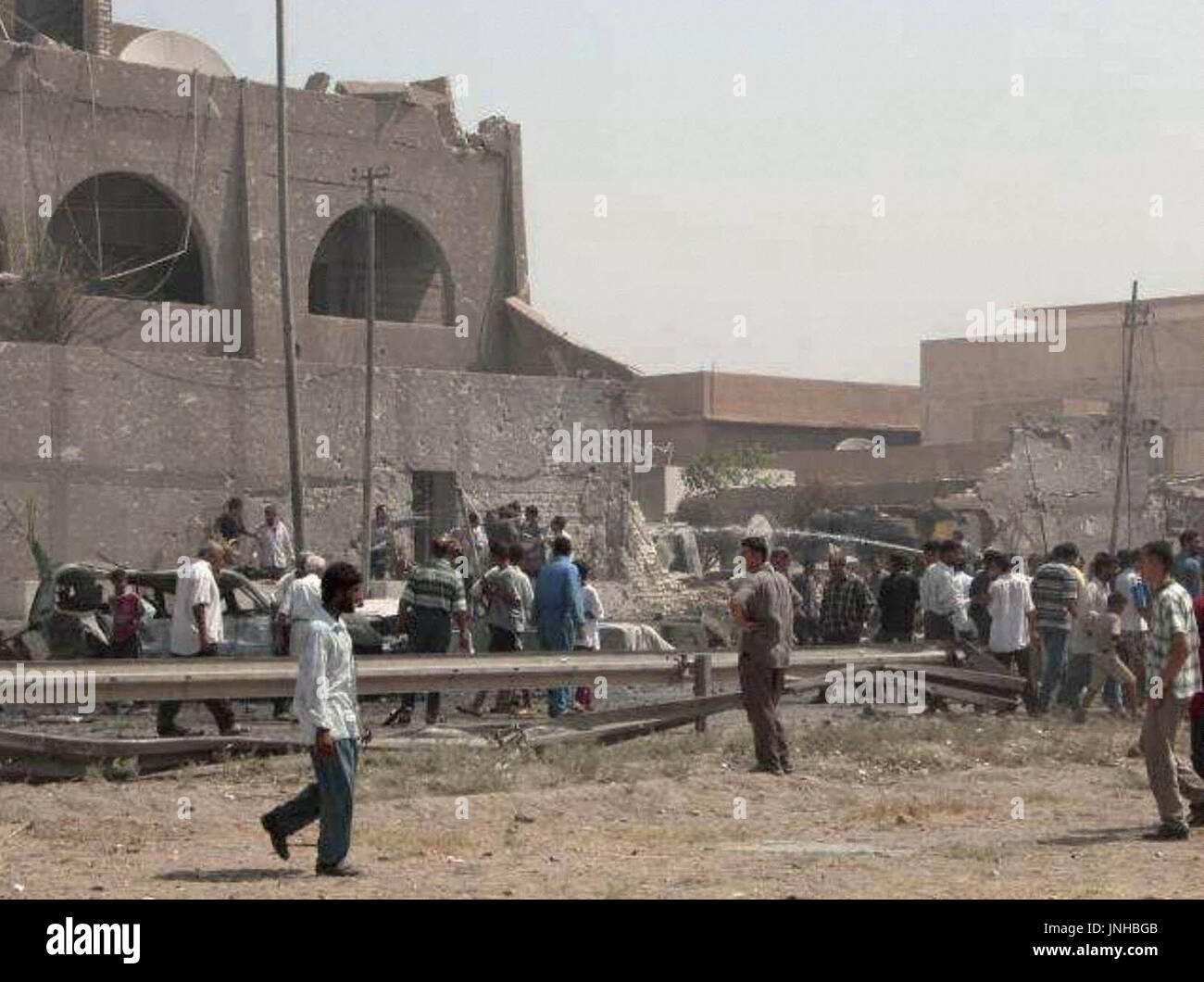 BAGHDAD, Iraq - A vehicle smolders after a massive car bomb explosion ...