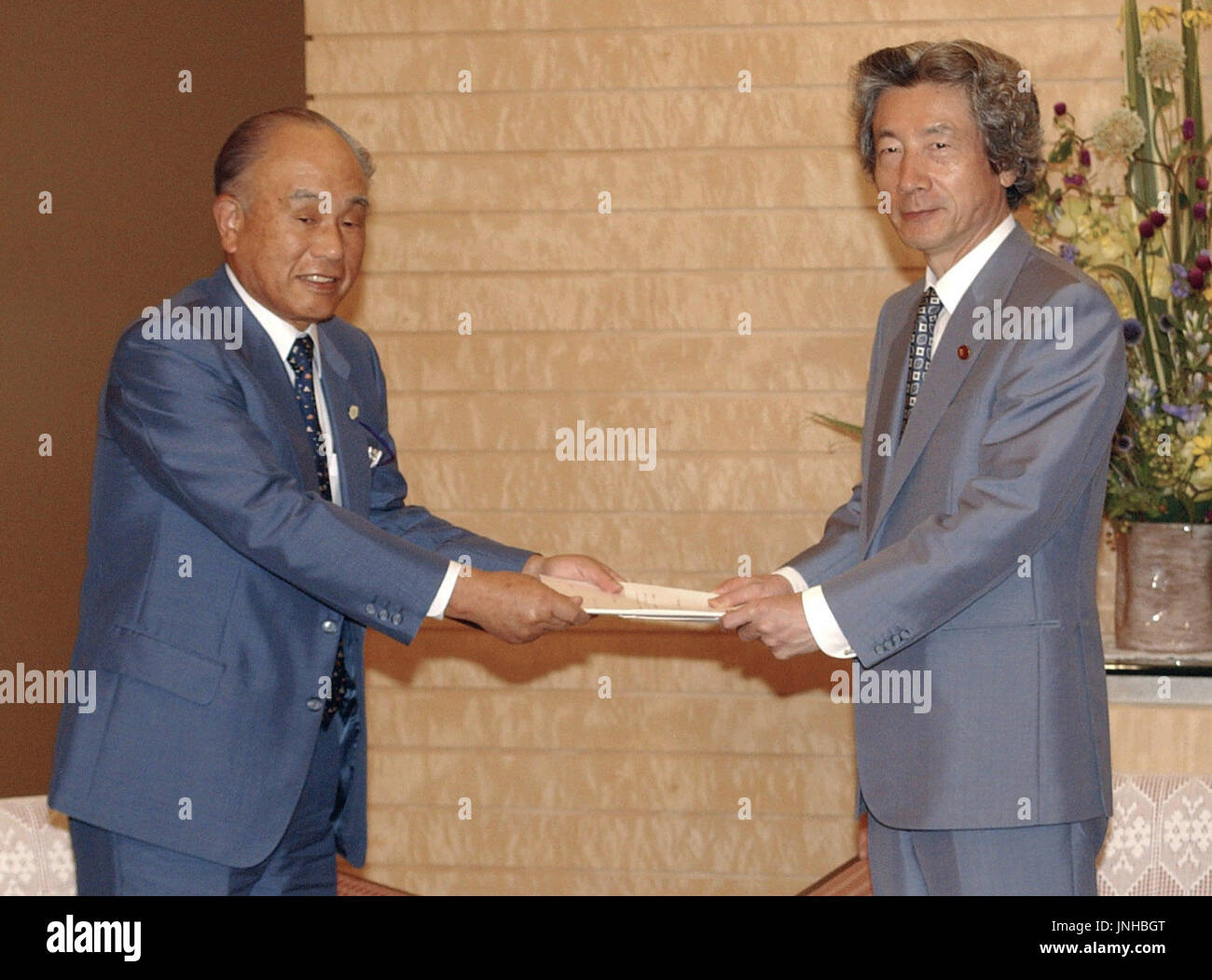 TOKYO, Japan - Tadayoshi Nakajima (L), president of the National ...
