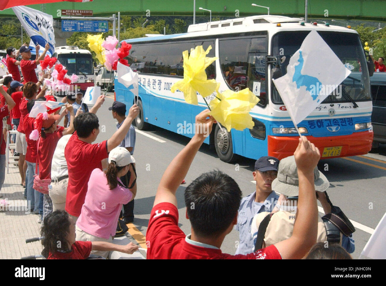 TAEGU, South Korea - Well-wishers wave unified Korean flags in Taegu on ...