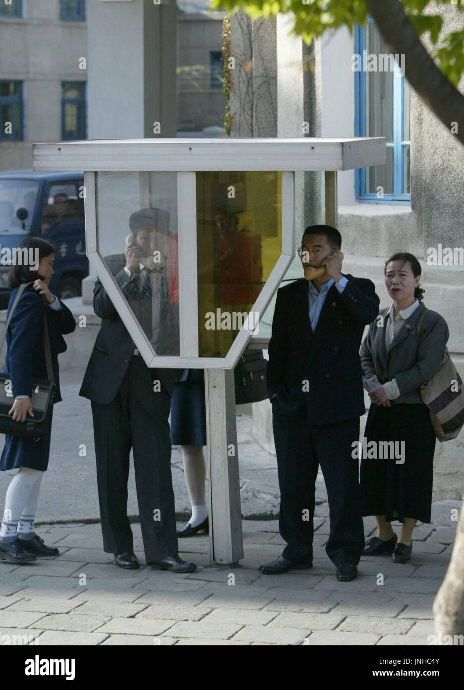 TOKYO, Japan - People using public payphones in central Pyongyang. The ...