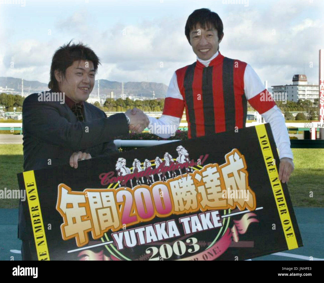 TAKARAZUKA, Japan - Japanese jockey Yutaka Take (R) is congratulated by ...