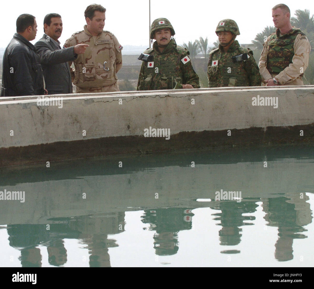 SAMAWAH, Iraq - Col. Masahisa Sato (4th from L), commanding an advance ...