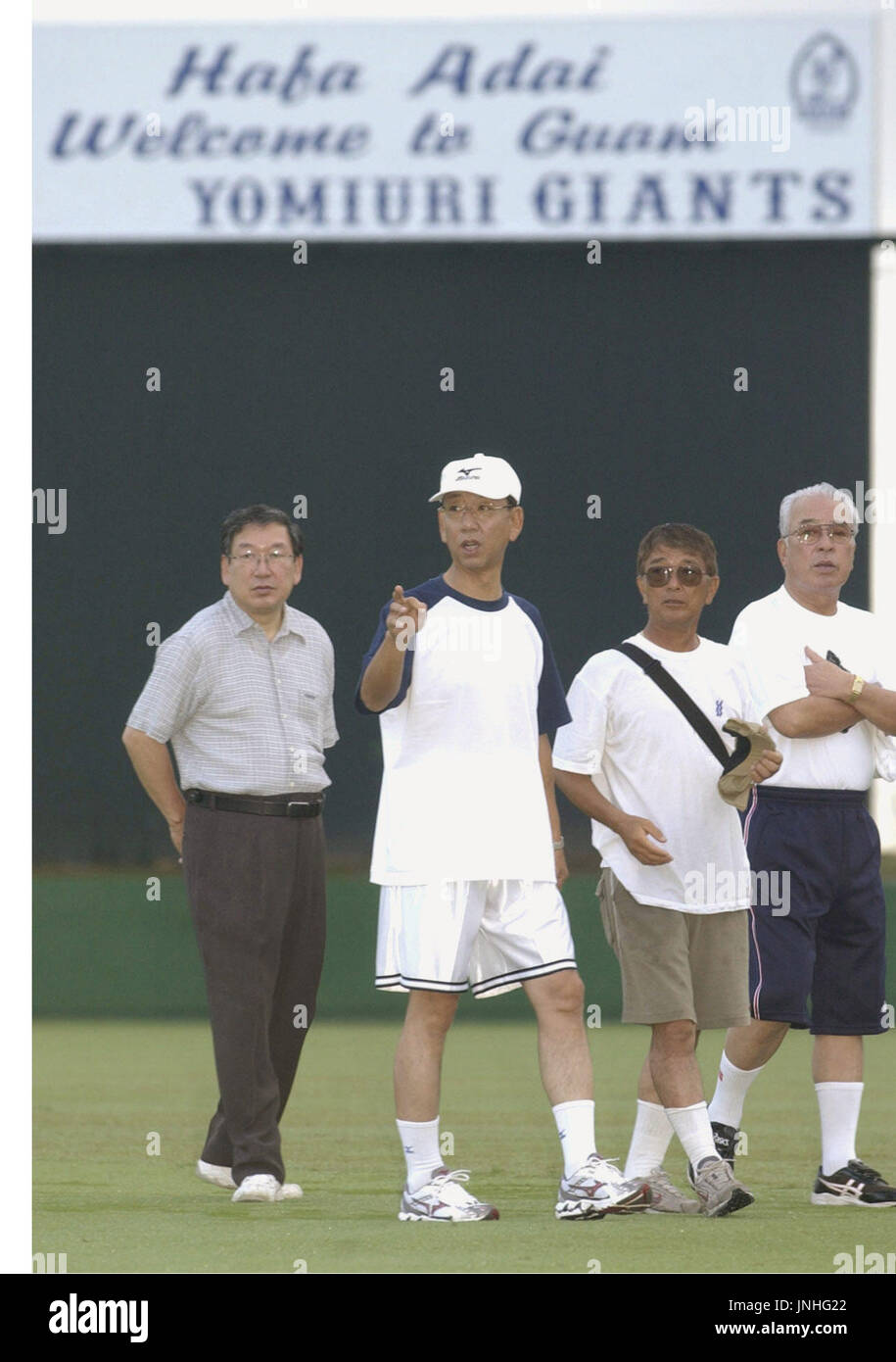 GUAM - Yomiuri Giants manager Tsuneo Horiuchi (2nd from L) inspects a ...