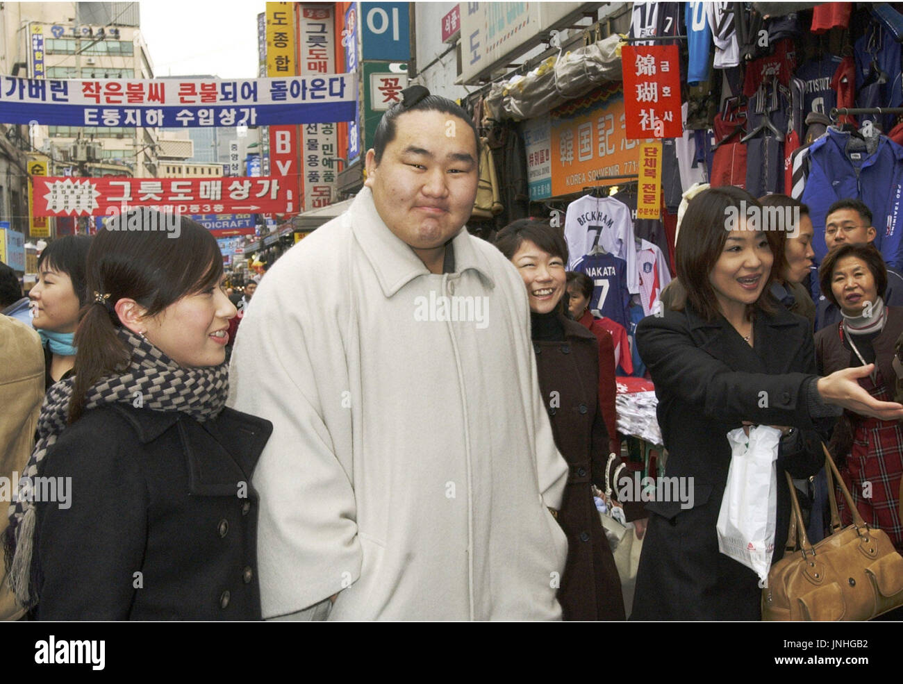 SEOUL, South Korea - Mongolian yokozuna Asashyoryu is followed by female fans as he walks along ...