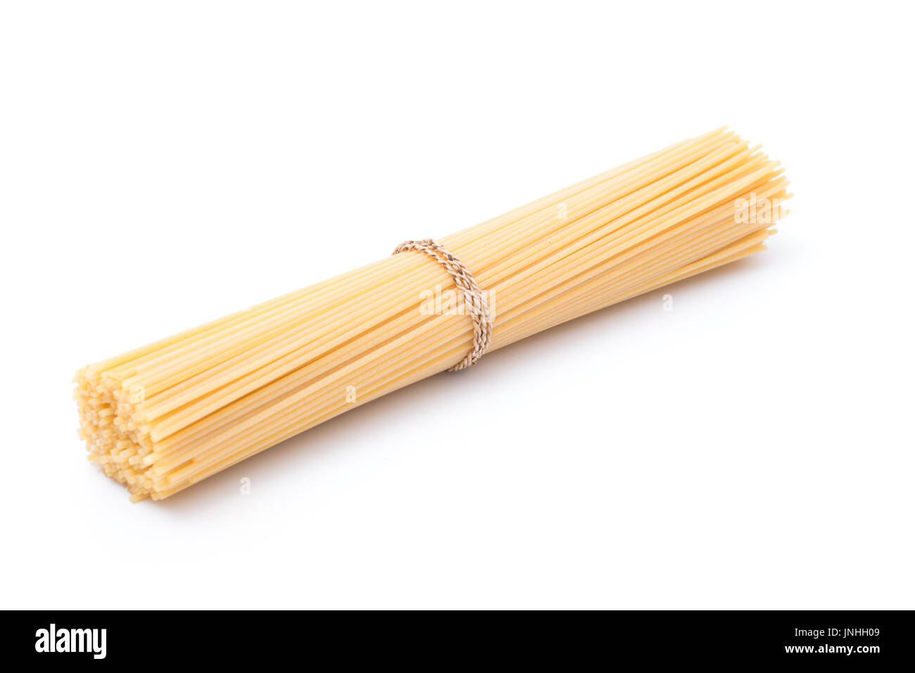 Raw spaghetti isolated on white background Stock Photo - Alamy