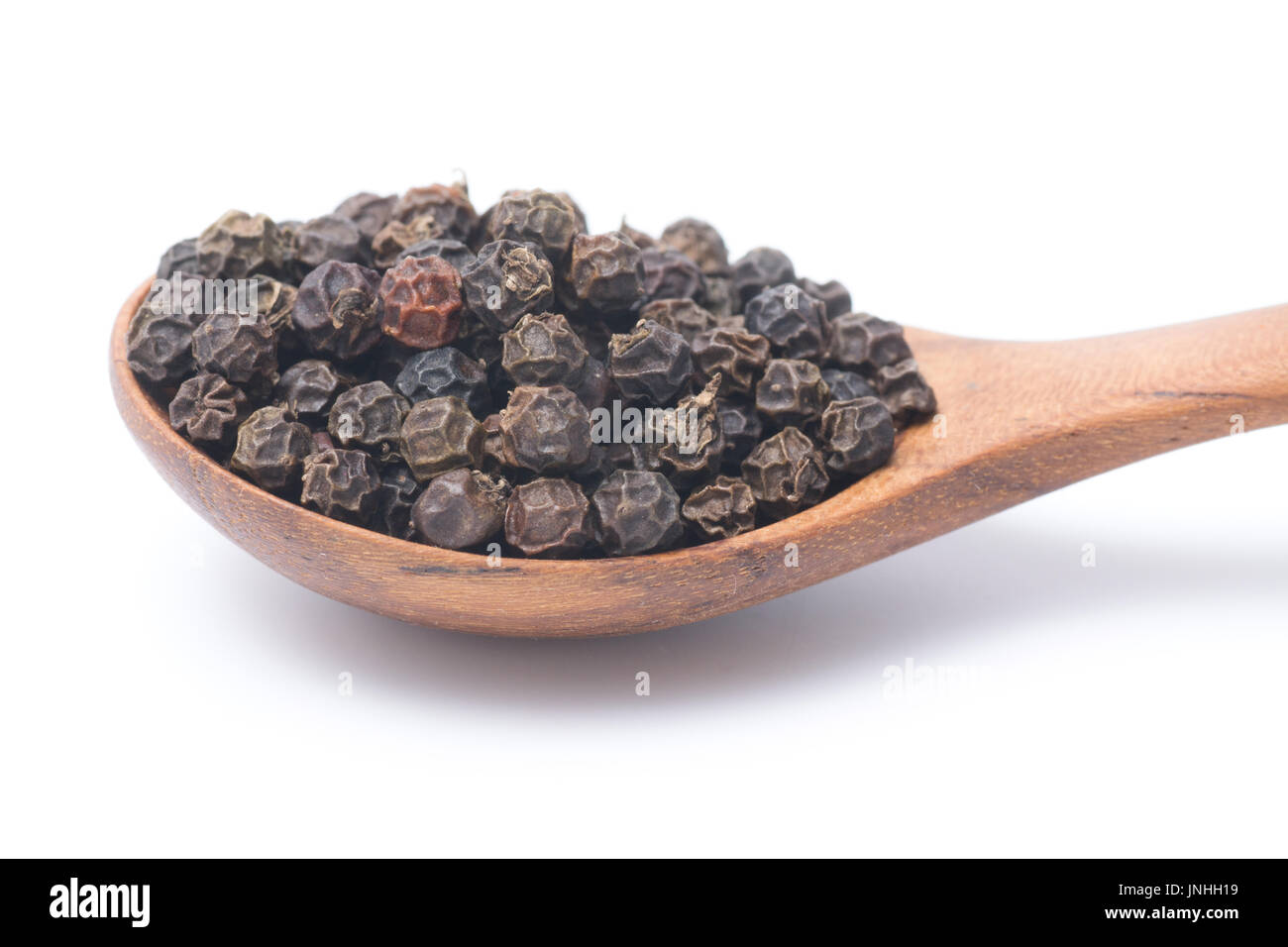 Close up peppercorns in wooden spoon isolated on white background Stock ...