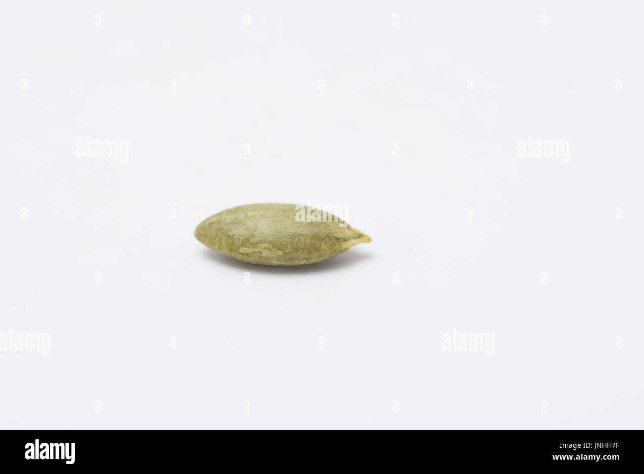 Roasted pumpkin kernels isolated on white background Stock Photo - Alamy