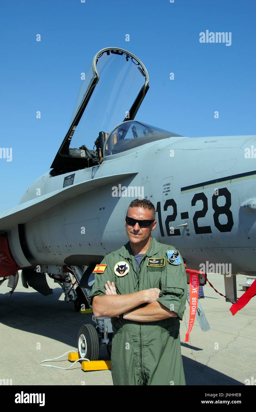 Pilot standing in front of a McDonnell Douglass F/A-18 Hornet of the ...