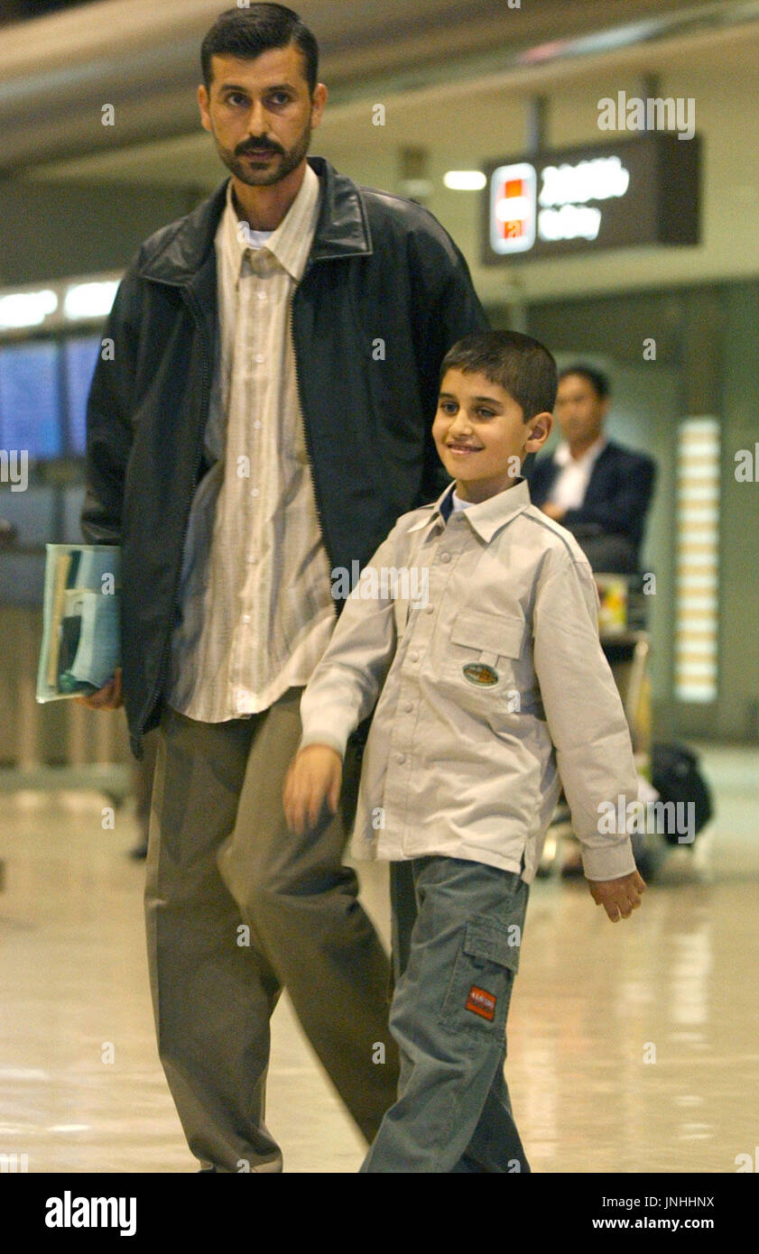 TOKYO, Japan - Mohamad Haytham Saleh (R), 10, is accompanied by his ...