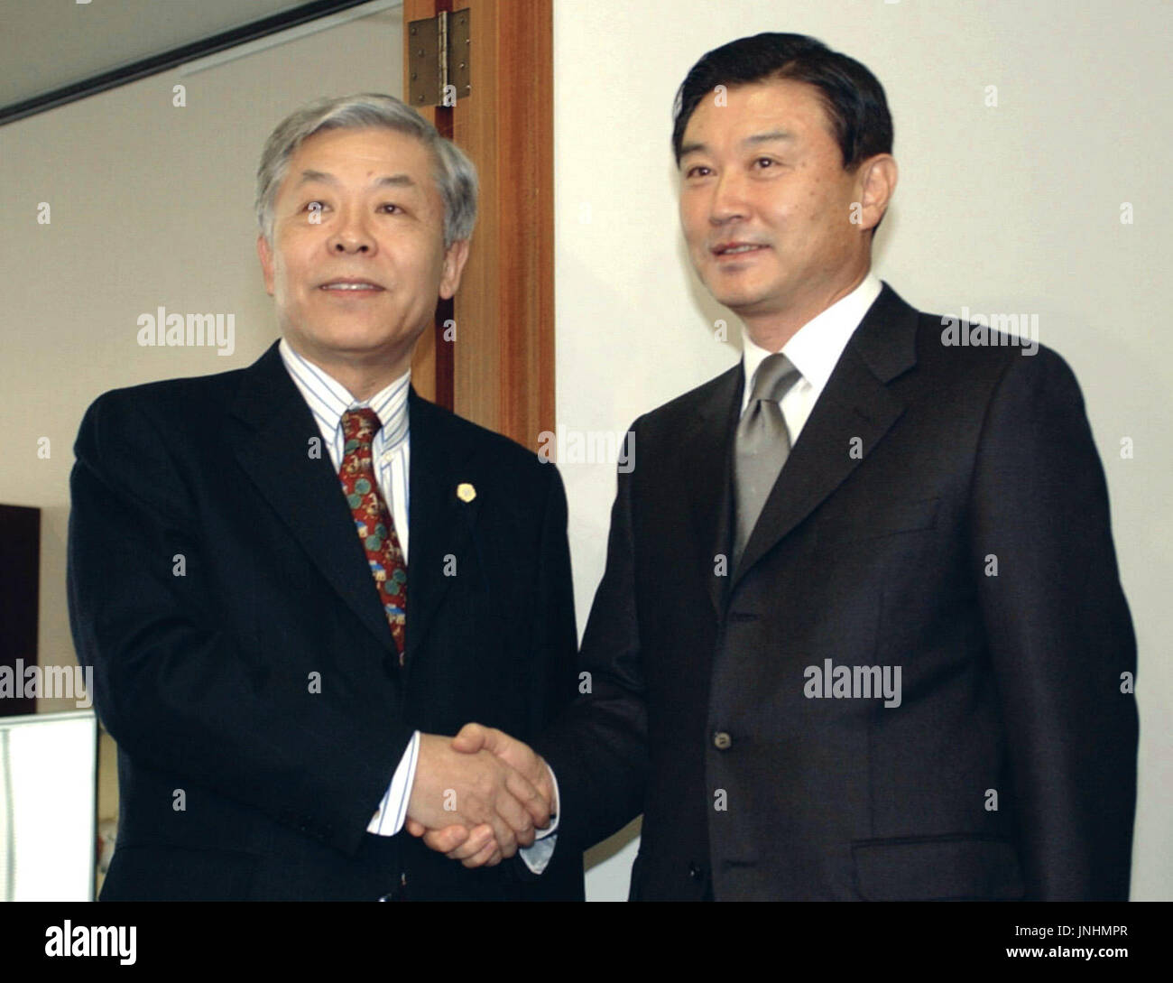 TOKYO, Japan - Japanese Vice Foreign Minister Yukio Takeuchi (L) and ...