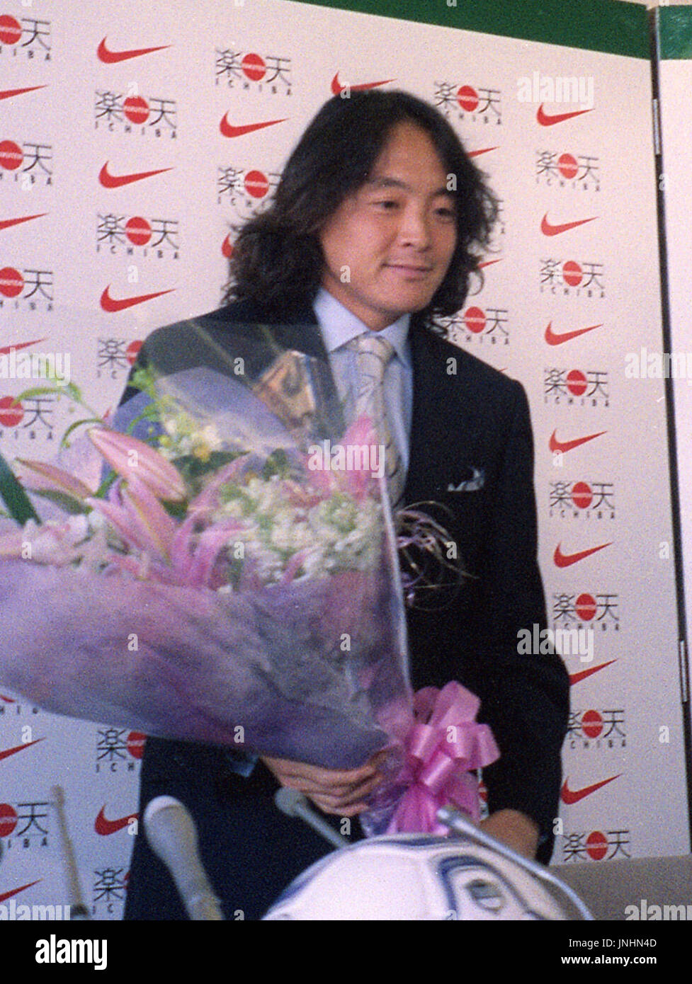 TOKYO, Japan - Former Japan midfielder Tsuyoshi Kitazawa holds a bunch ...