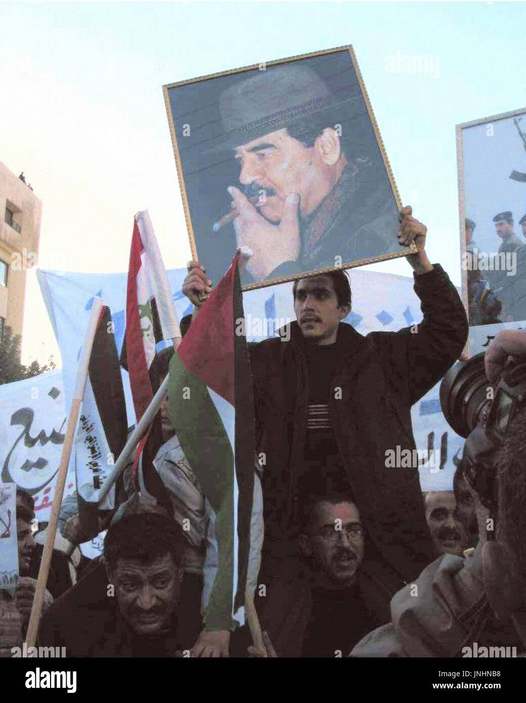 AMMAN, Jordan - Jordanians carrying portraits of Iraqi President Saddam ...
