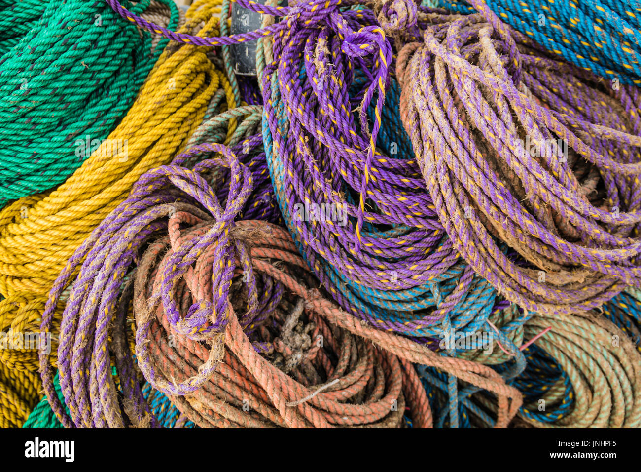 Colorful sink, hydropro and float ropes used for lobster traps piled up ...