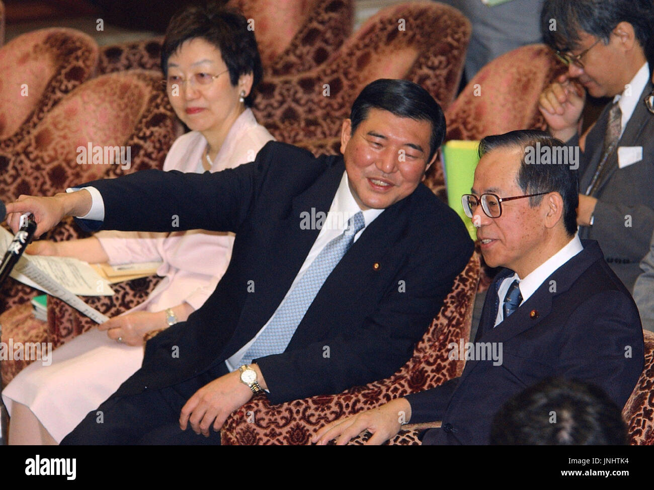 TOKYO, Japan - Chief Cabinet Secretary Takeo Fukuda (R) chats smilingly ...