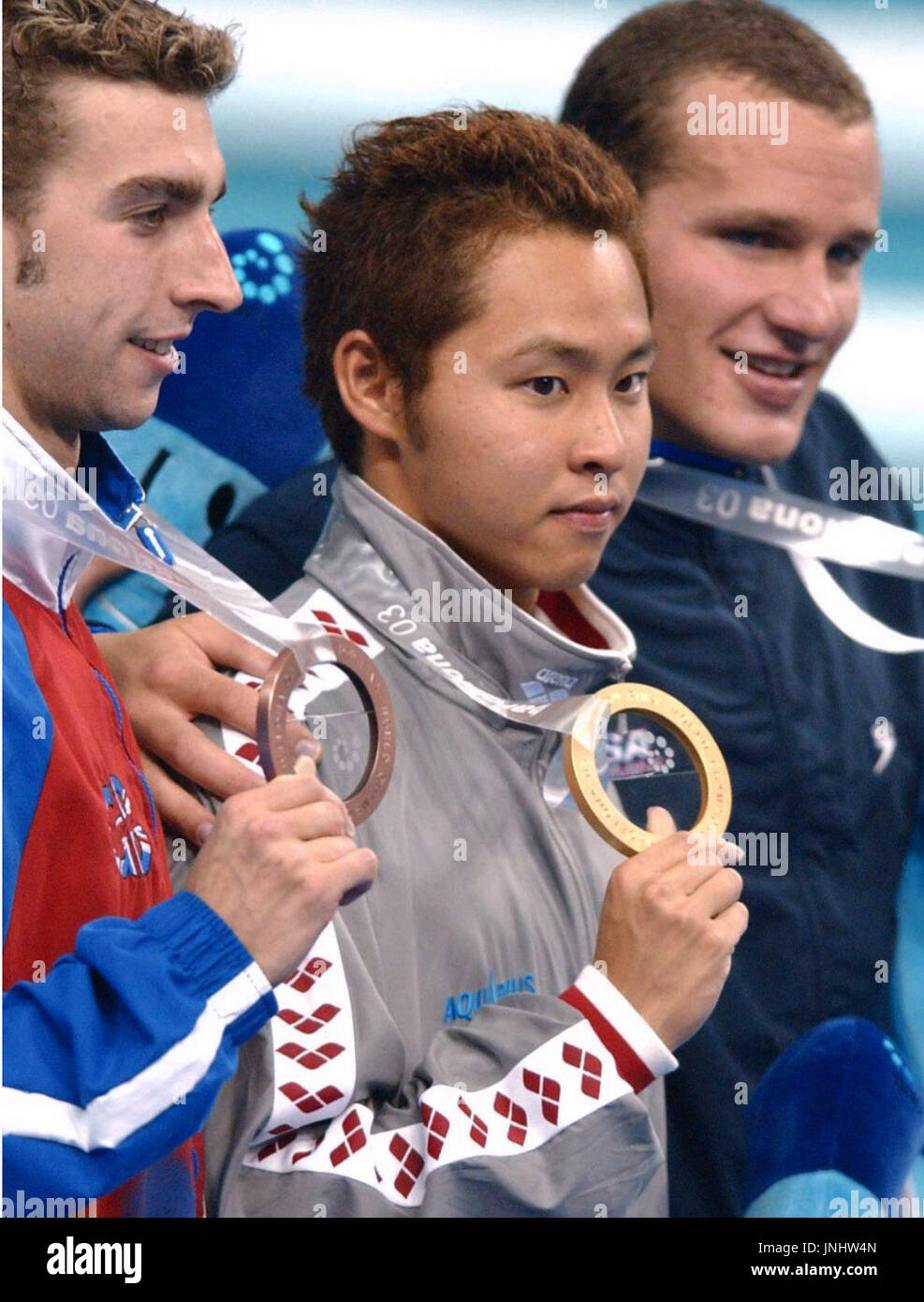 BARCELONA, Spain - Japanese swimmer Kosuke Kitajima (C) shows off the ...