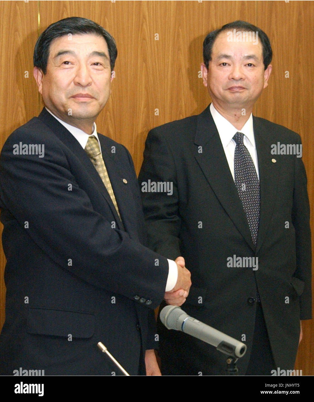 TOKYO, Japan - Motoki Ozaki (R), a board member of the top Japanese ...