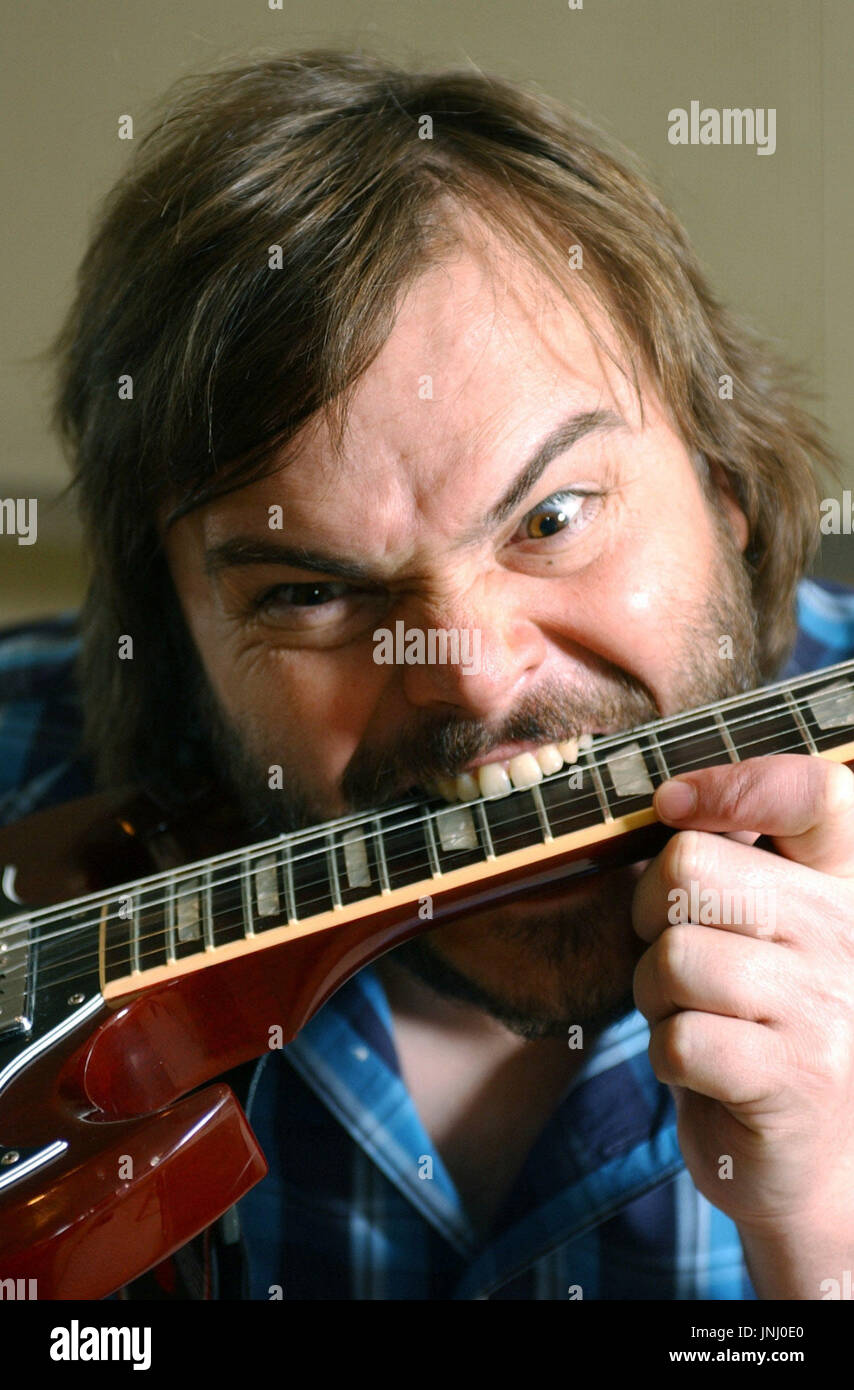 TOKYO, Japan - Hollywood movie star Jack Black bites into a guitar at a ...