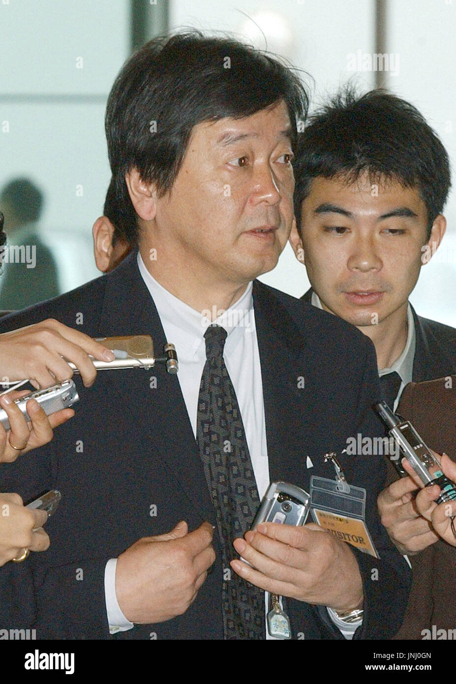 TOKYO, Japan - Hitoshi Tanaka, deputy foreign minister, is surrounded ...