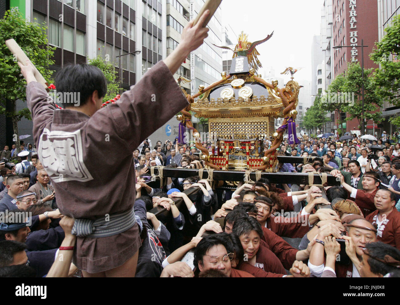 TOKYO, Japan - People carrying a portable shrine take to the streets ...
