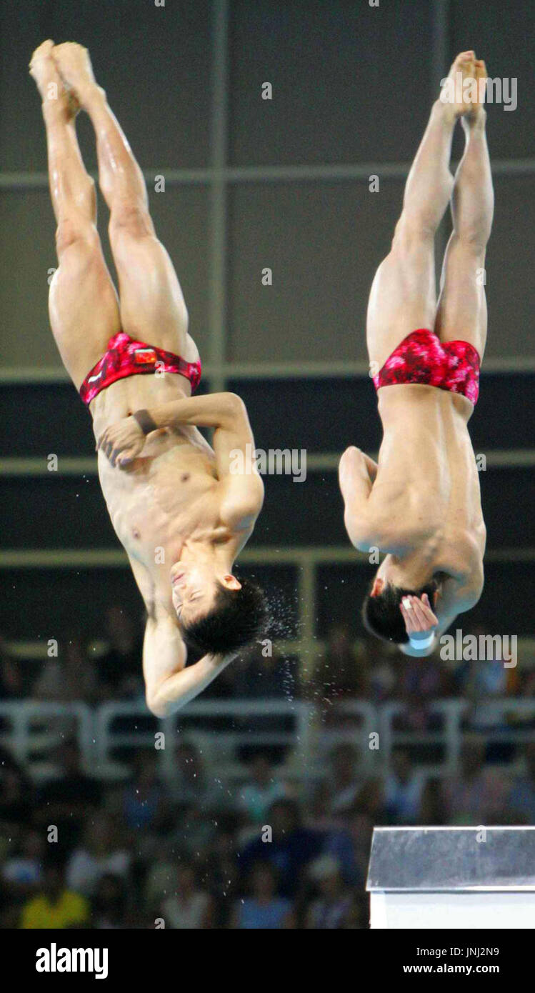 ATHENS, Greece - Tian Liang and Yang Jinghui of China dive for their ...