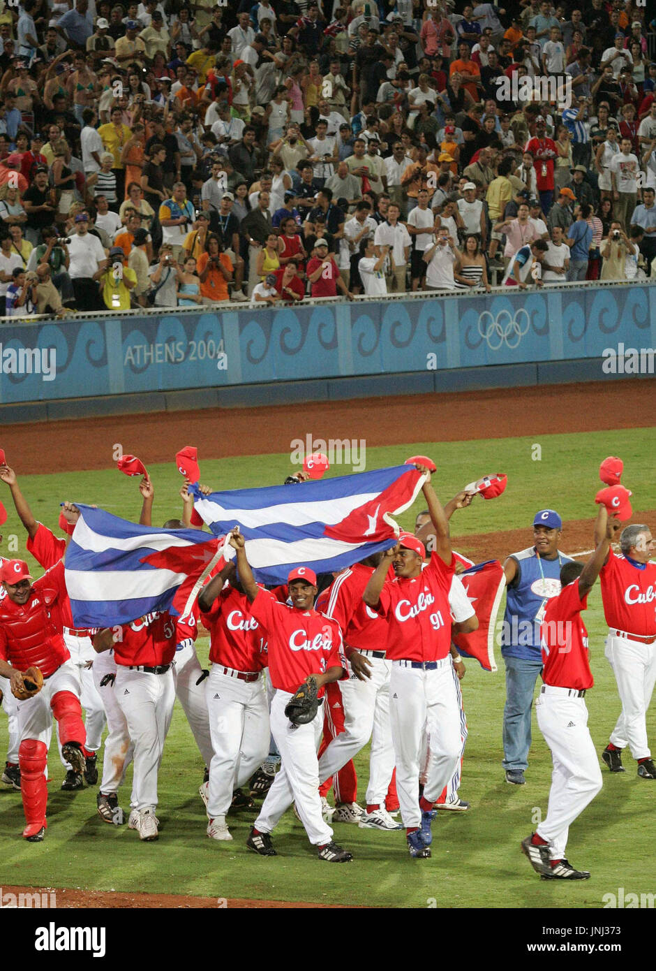 ATHENS, Greece - Cuba's baseball players, carrying the national flag ...