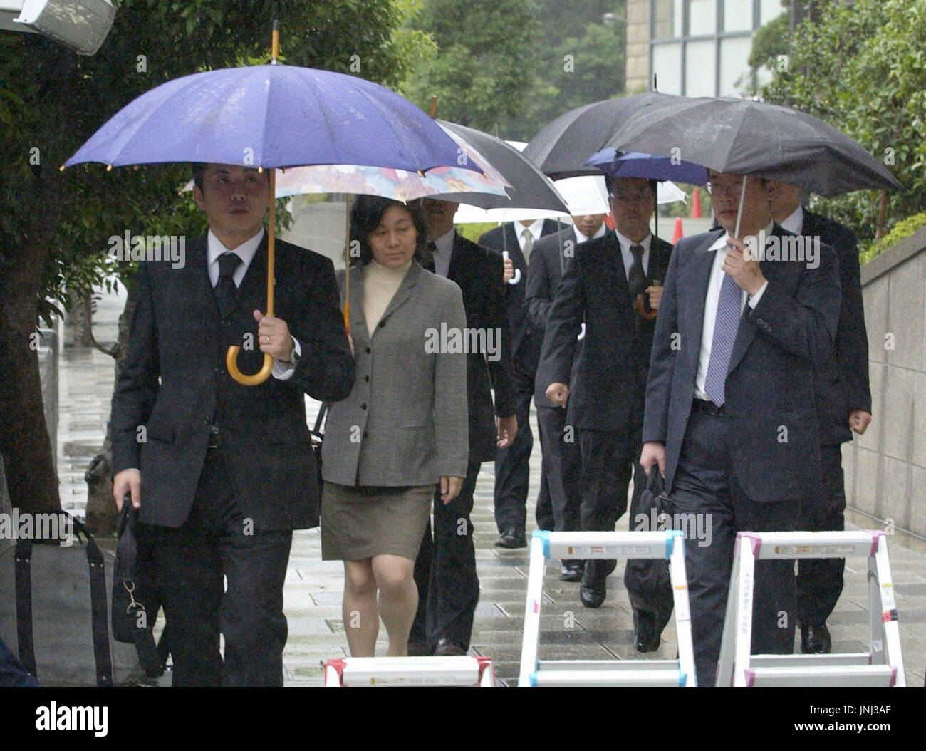 TOKYO, Japan - Prosecutors walk to the office of the largest faction of ...