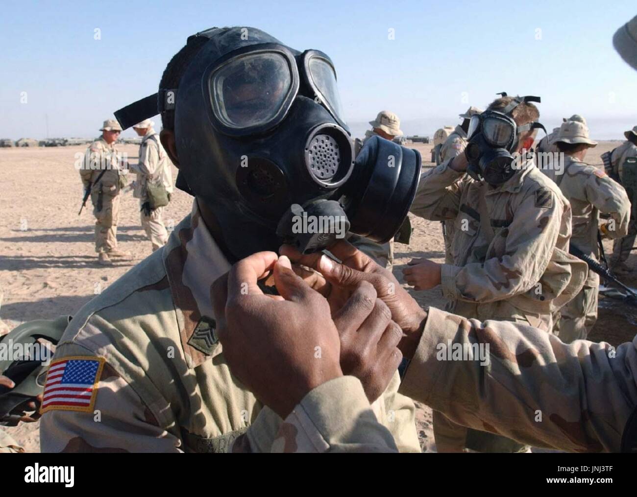 KUWAIT - U.S. soldiers check their gas masks in northern Kuwait on ...