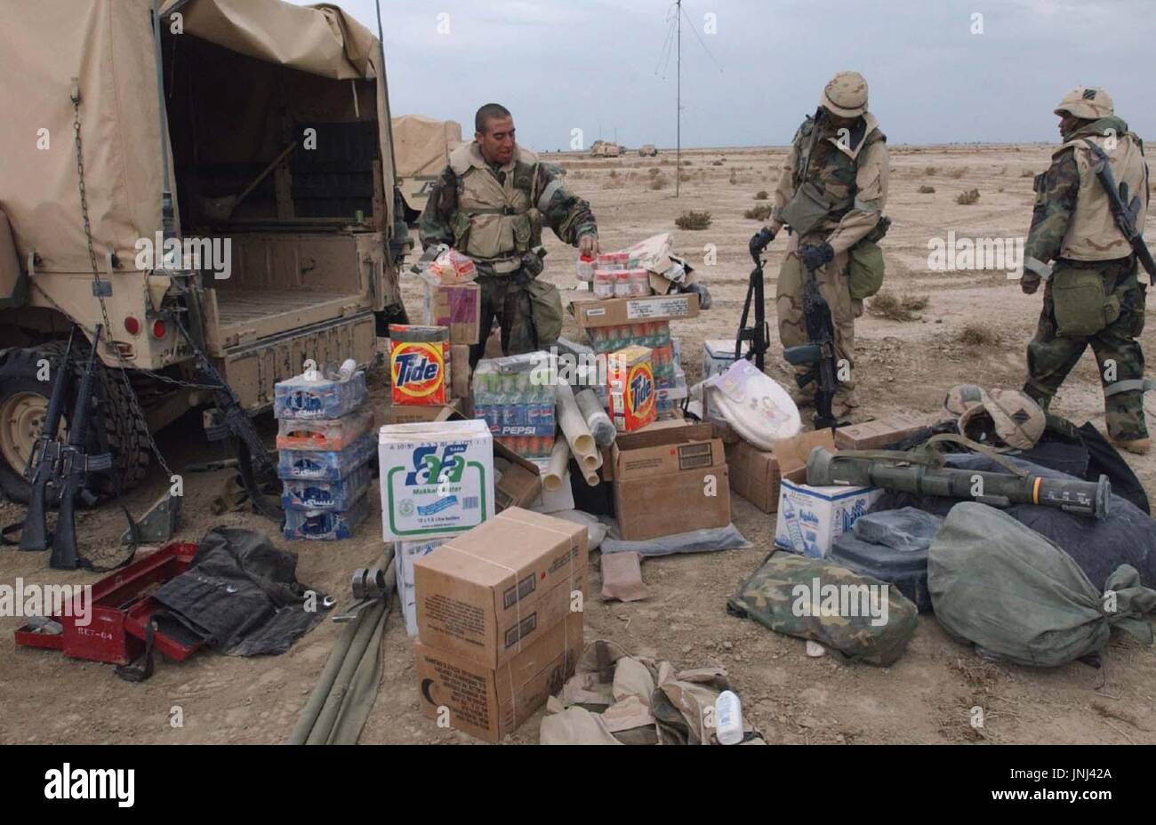 SOUTHERN IRAQ, Iraq - U.S. Army soldiers examine the load from their ...