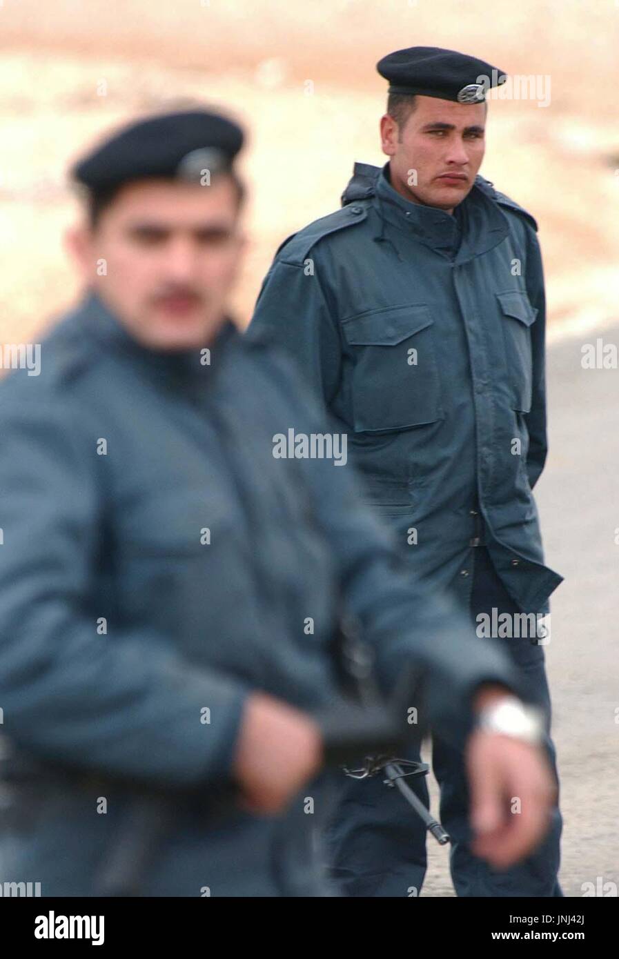 AMMAN, Jordan - Two Jordanian guards stand on duty at the Jordanian ...