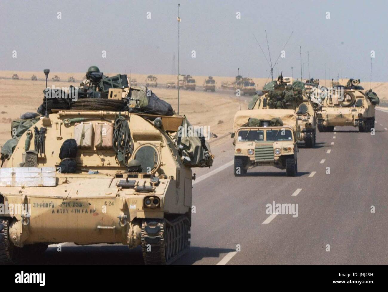 NASIRIYAH, Iraq - U.S. tanks and armored vehicles drive in the suburbs ...