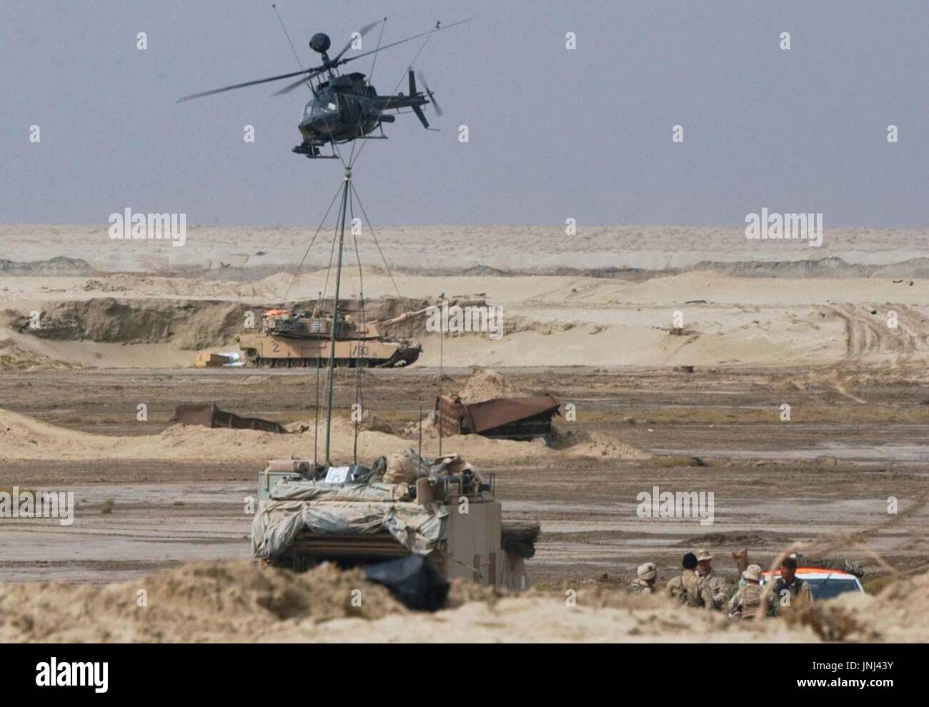 SOUTHERN IRAQ, Iraq - A U.S. helicopter and vehicle are seen deployed ...