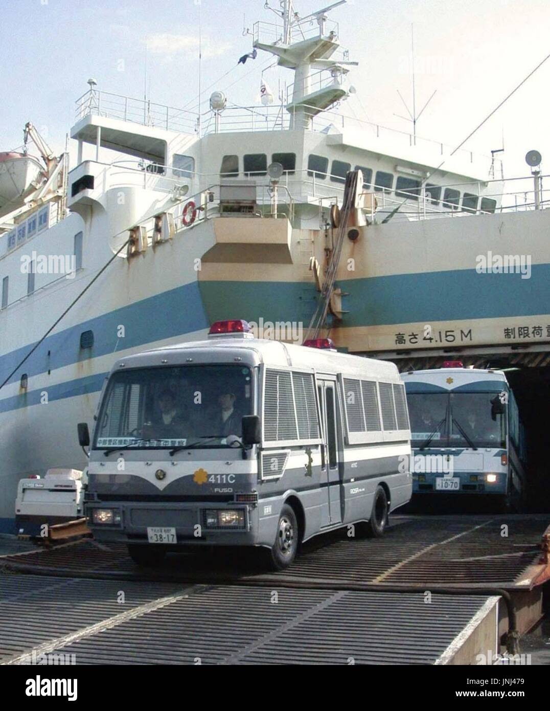 NAHA, Japan - Vehicles carrying the first group of riot police arrive ...