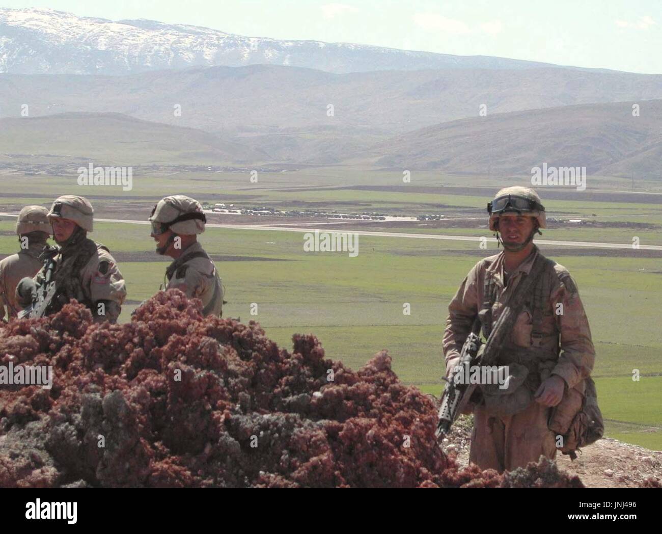 HARIR, Iraq - U.S. soldiers stand guard around an airstrip in Harir in ...