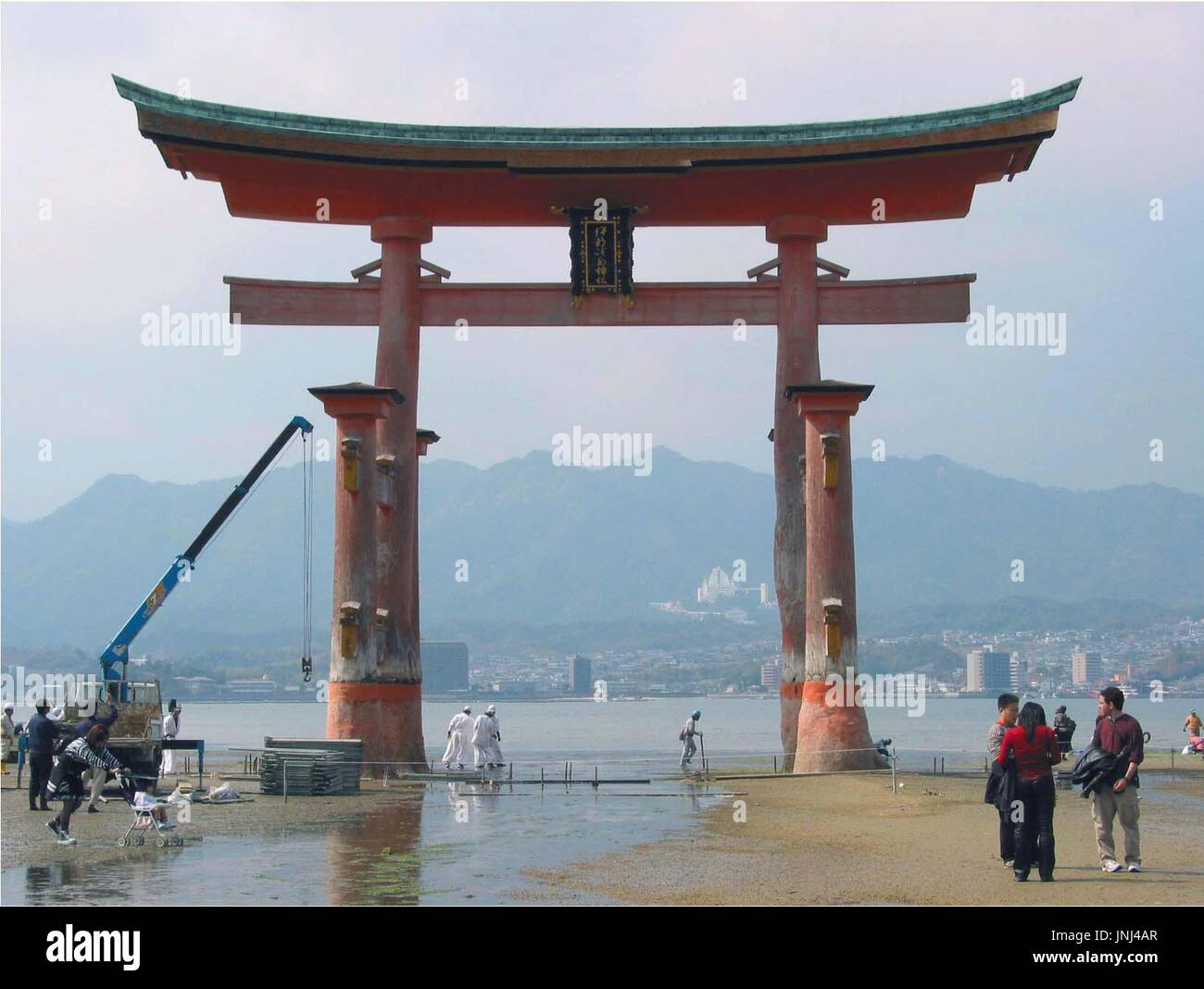 HIROSHIMA, Japan - Repainting work at Itsukushima Shrine's huge Torii ...