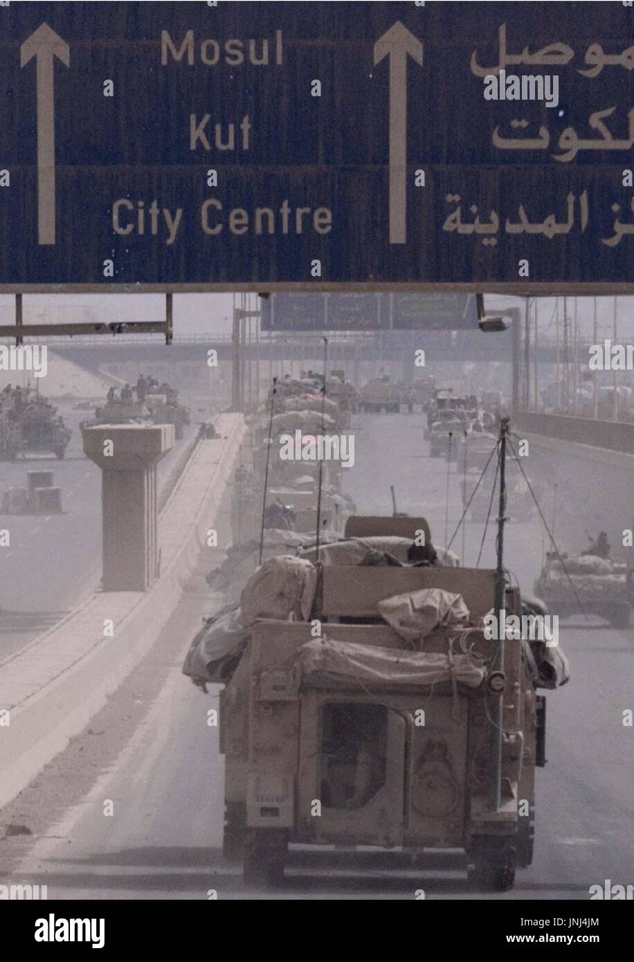 BAGHDAD, Iraq - U.S. Army armored vehicles run along a highway leading ...