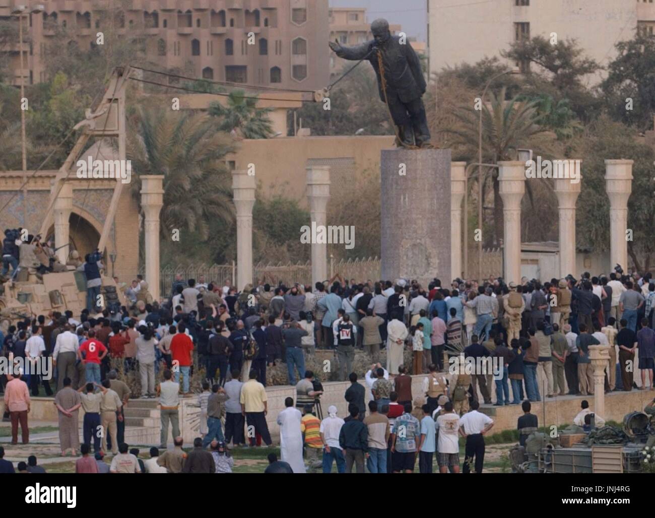 BAGHDAD, Iraq - Iraqis watch U.S. soldiers pull down a huge statue of ...
