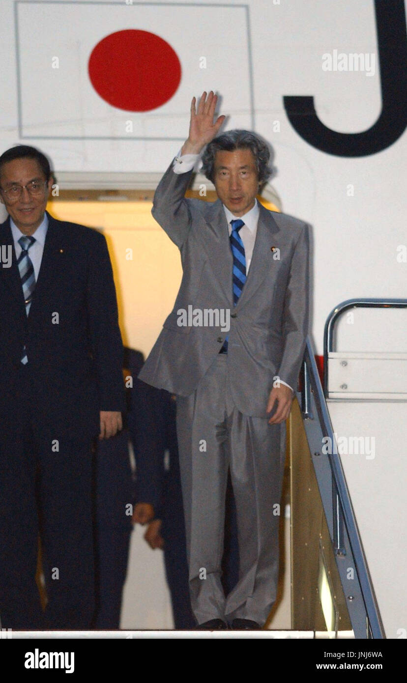 TOKYO, Japan - Prime Minister Junichiro Koizumi waves as he leaves ...