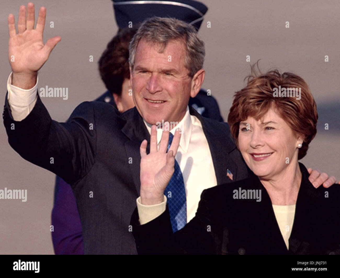 TOKYO, Japan - U.S. President George W. Bush and his wife Laura wave as ...