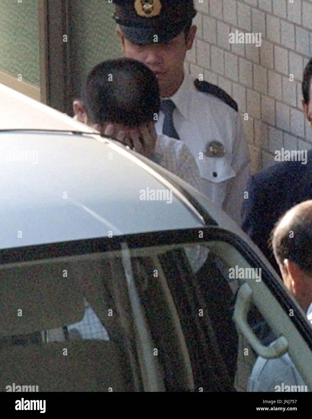 FUKUOKA, Japan - Wei Wei (L), a 23-year-old Chinese suspect in the ...