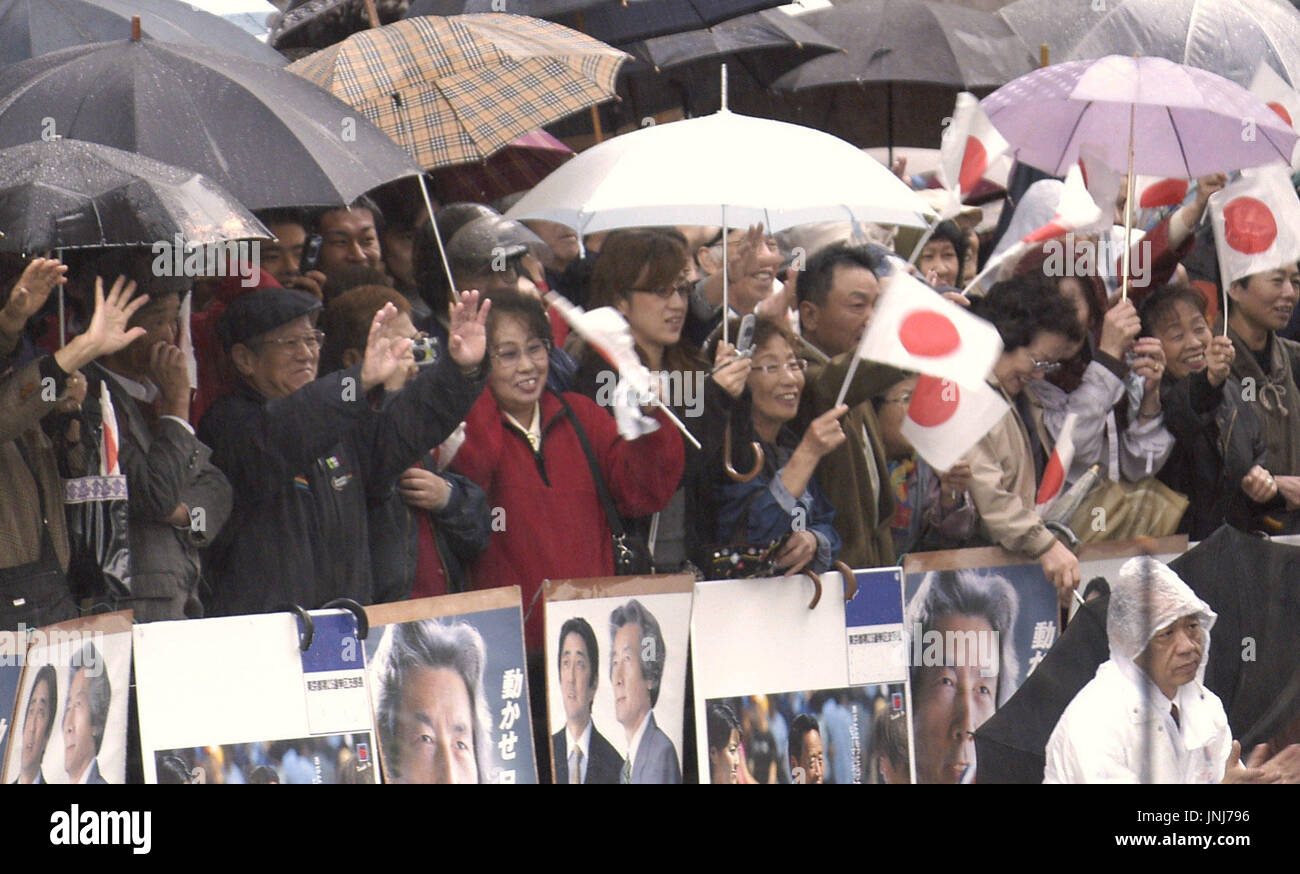 TOKYO, Japan - Citizens cheer a political candidate near JR Tamachi ...
