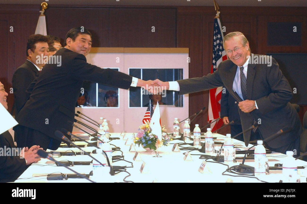 TOKYO, Japan - U.S. Secretary of Defense Donald Rumsfeld (R) shakes ...